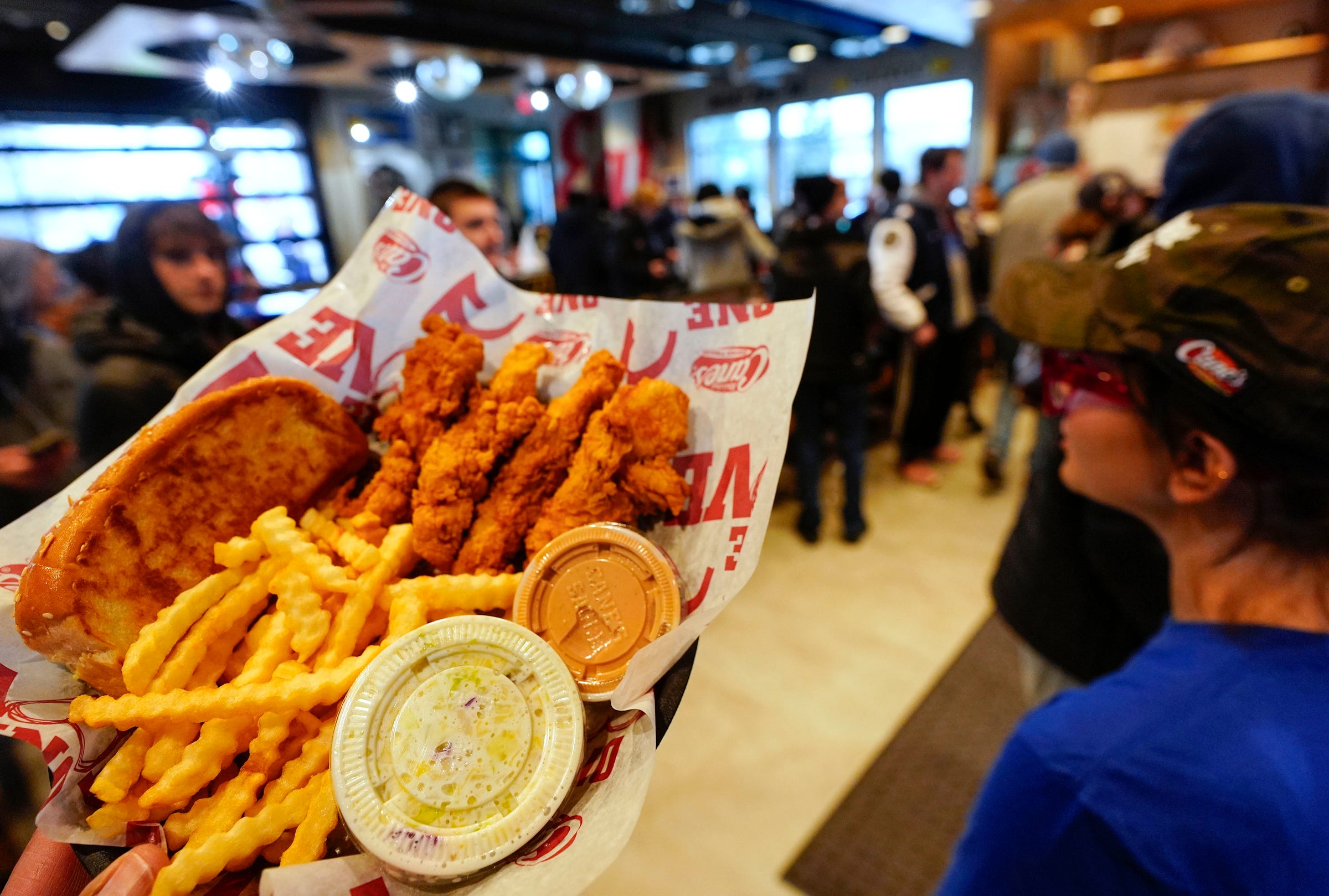 Fans wait for hours at Raising Cane’s first metro Detroit eatery