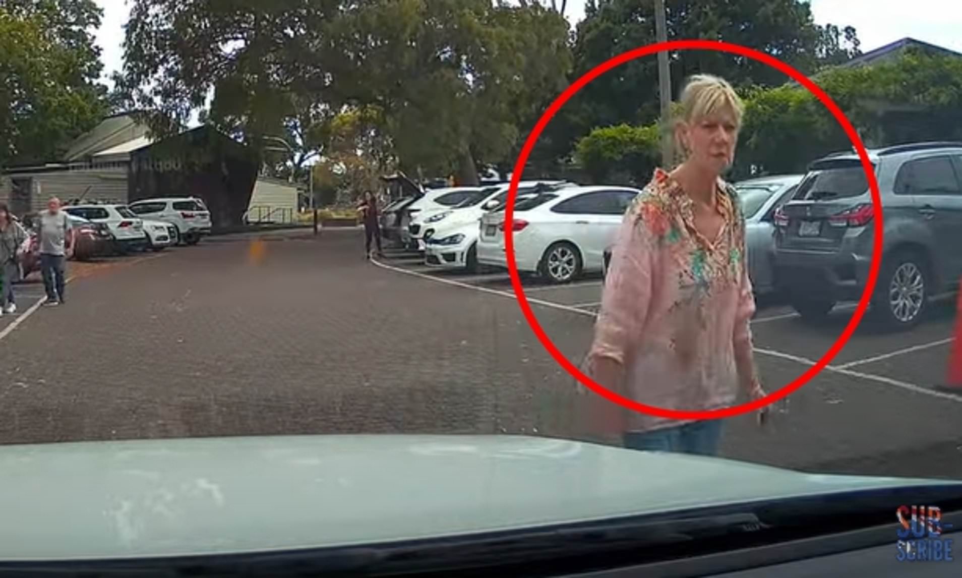 Woman blocks driver from parking spot before unleashing 'racist' rant