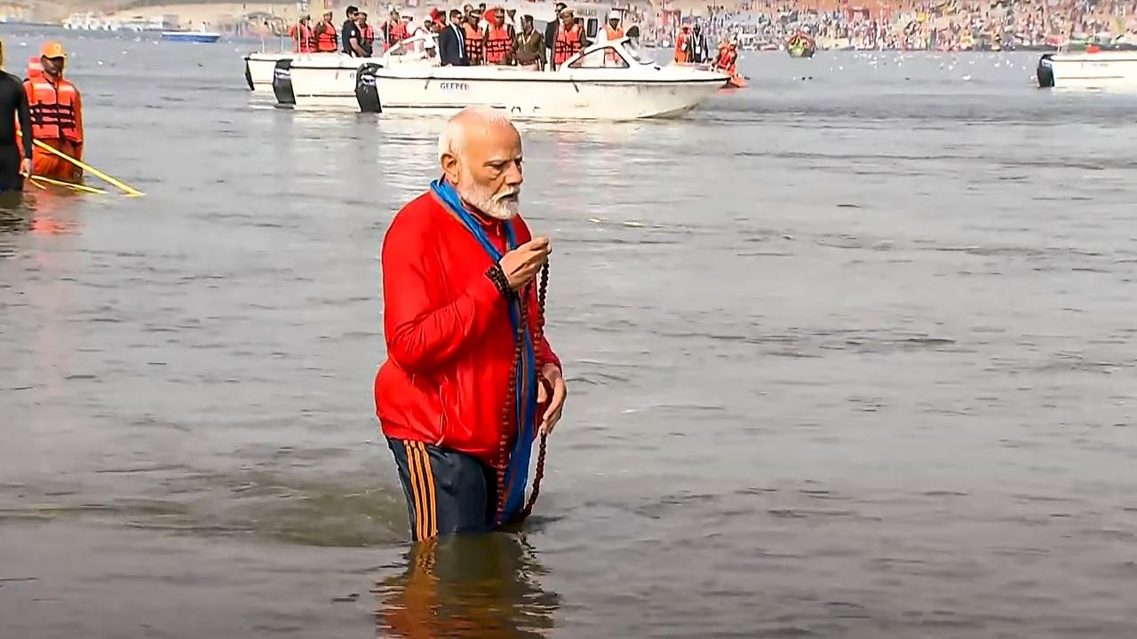 In Photos PM Modi at Maha Kumbh 2025 takes holy dip at Triveni Sangam