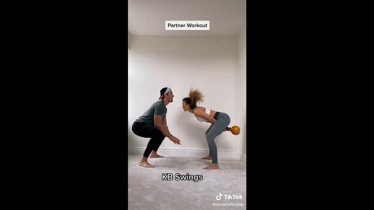 Doing A Partner Workout Using KB Swings