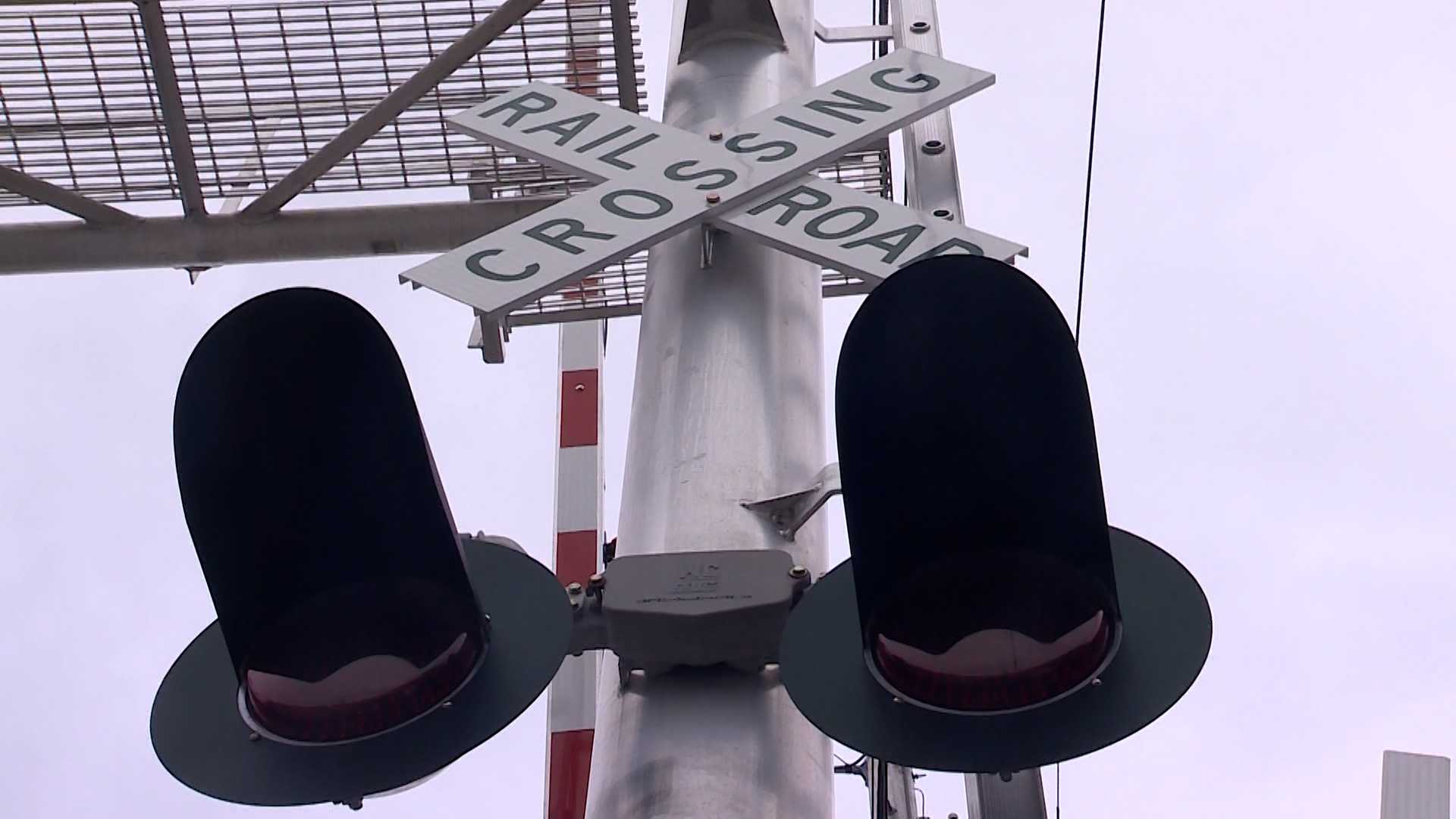 Woodfords Corner railroad crossing gates locked in down position for ...
