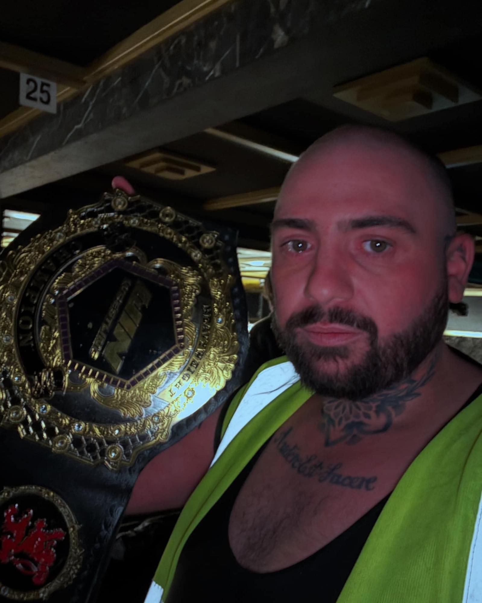Daventry wrestler celebrating after winning championship belt at ...