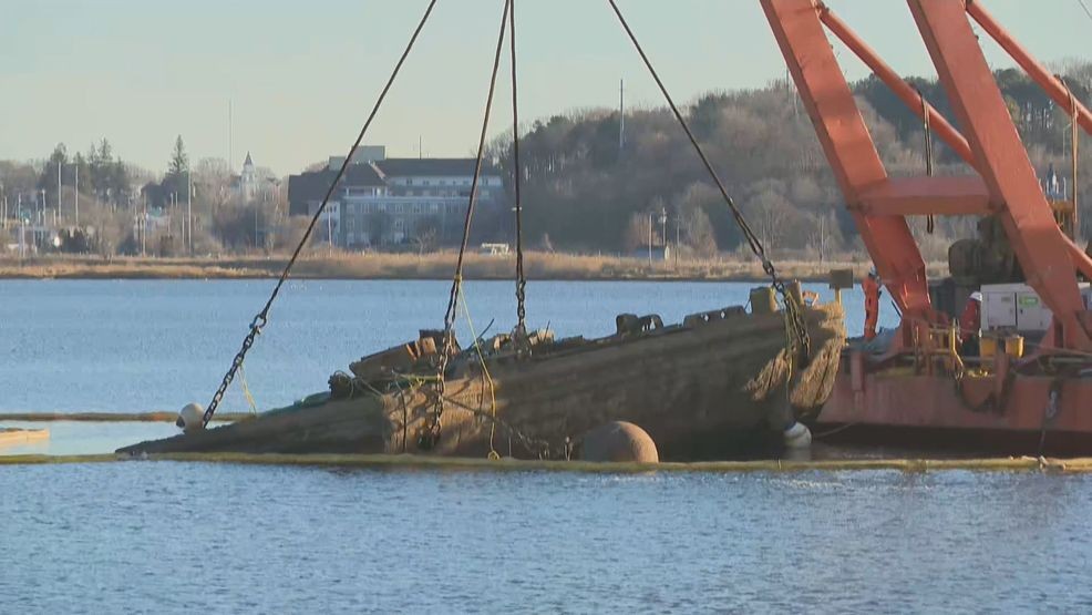 Crews work to pull out sunken barge out of Providence River