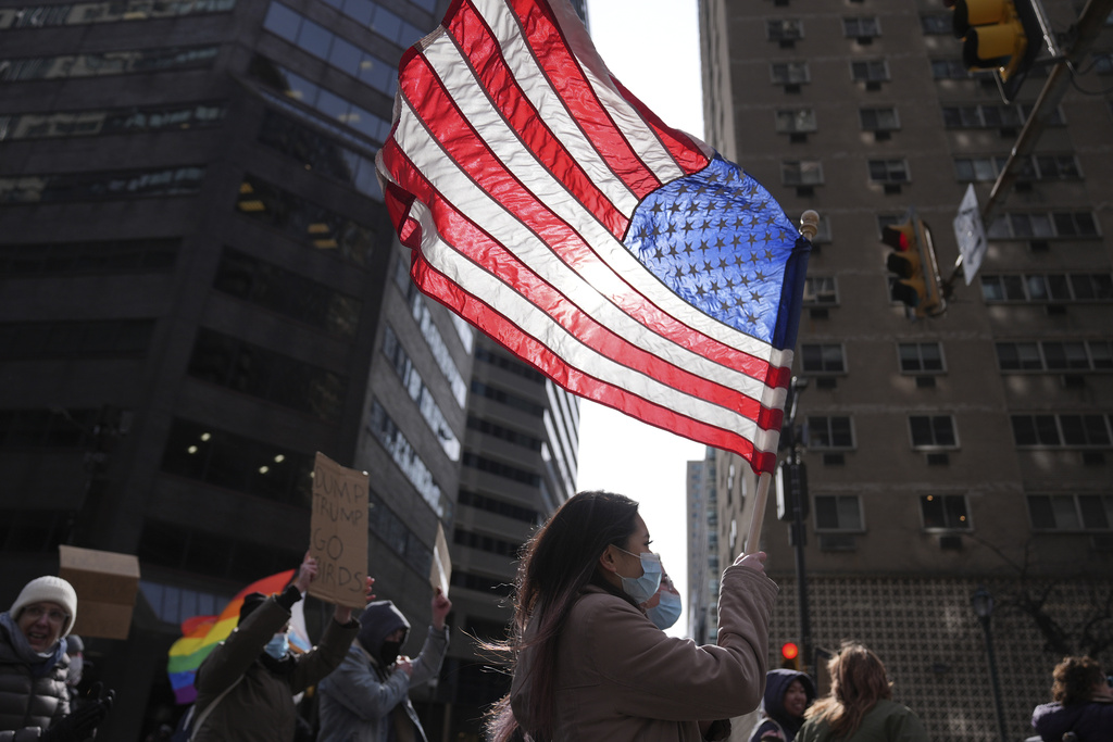 Protesters in cities across the US rally against Trump's policies ...