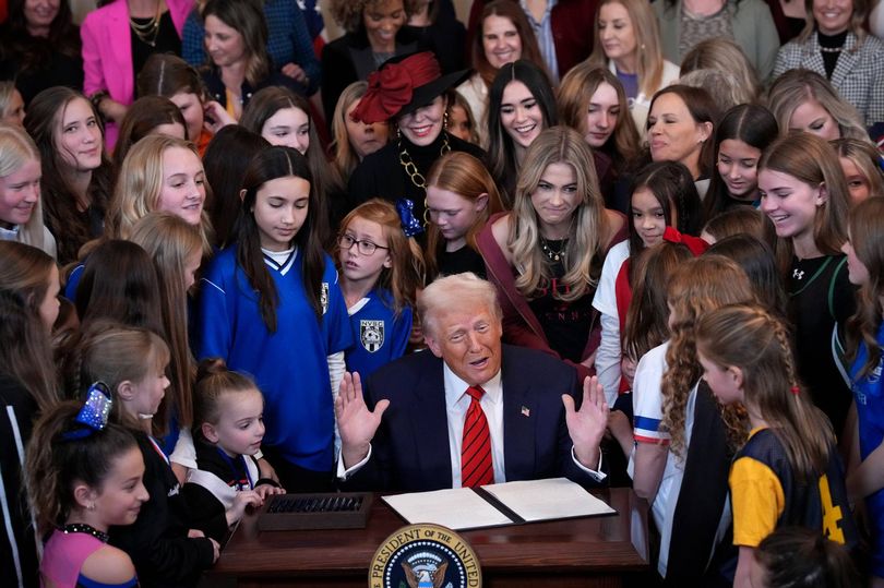 Trump jokes with young girls as he signs executive order banning trans ...