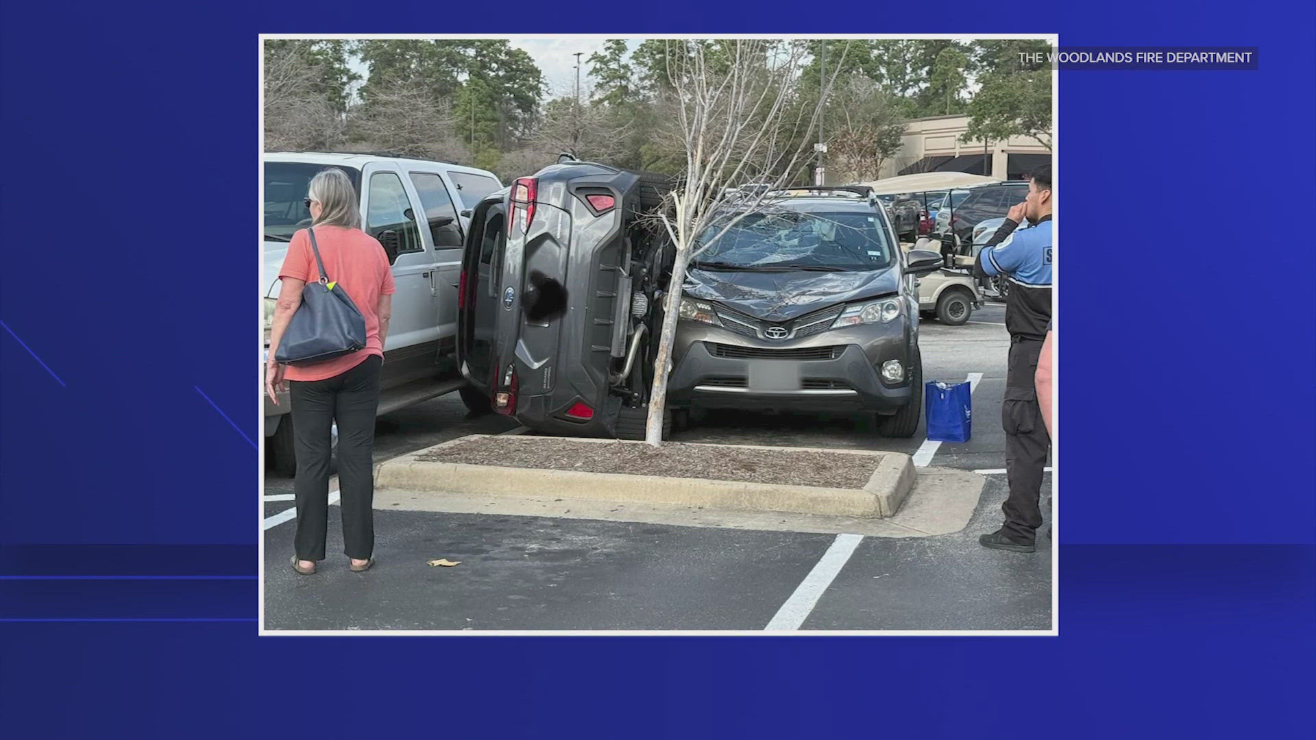 Car gets wedged in H-E-B parking lot in The Woodlands