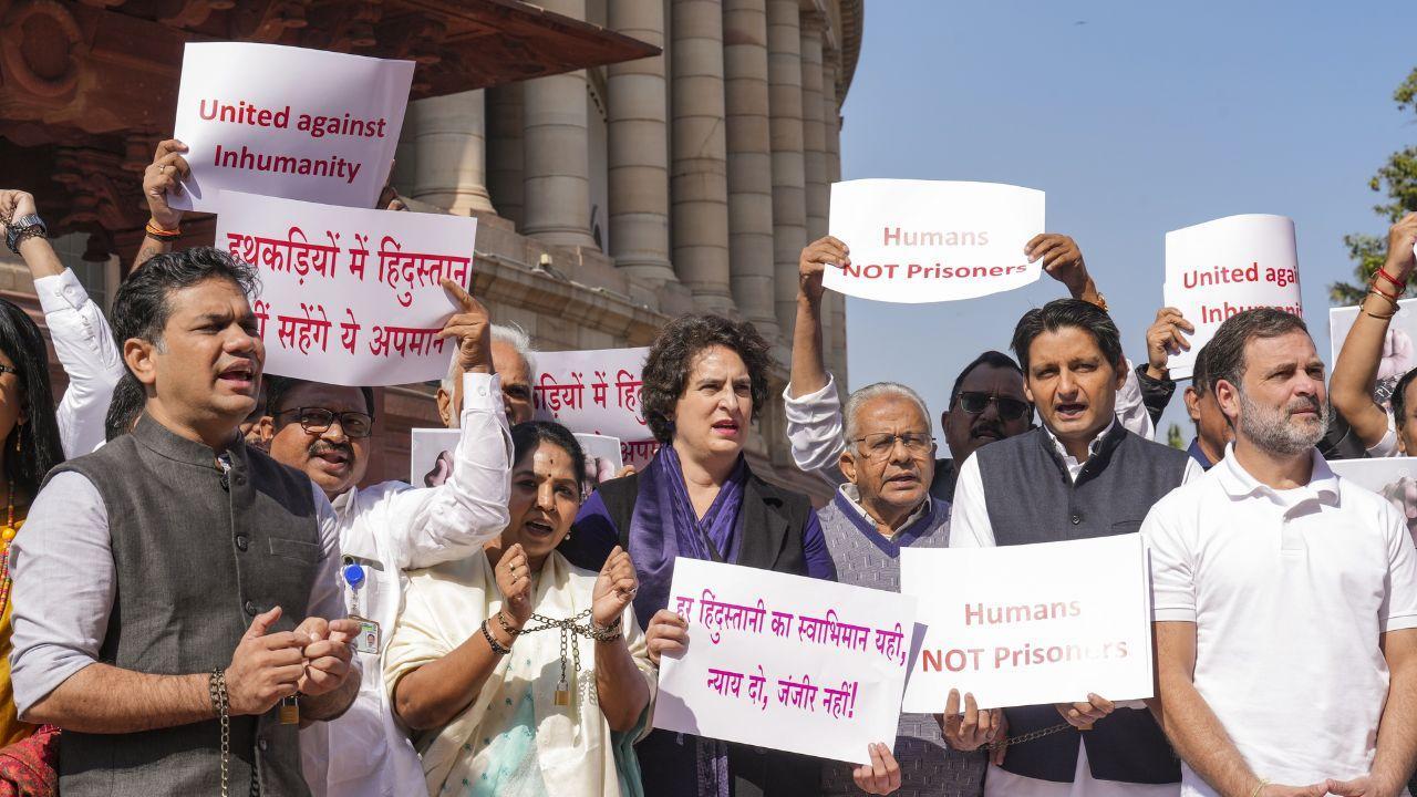 Opposition protest US deportation of Indians, several MPs sport handcuffs