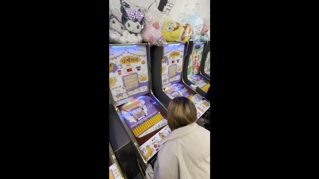 Locals engrossed by pinball arcade machines in Taiwan