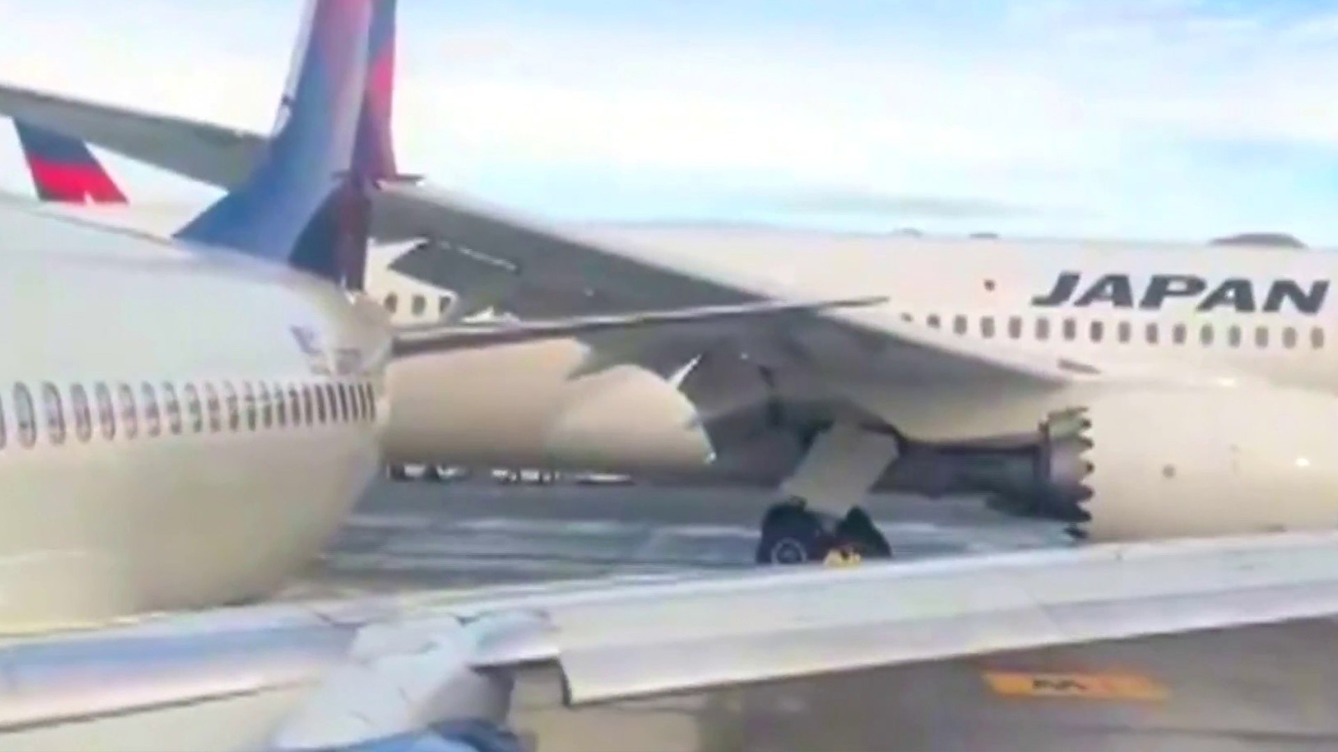 Wing of Japan Airlines plane slices into tail of Delta jet in Seattle