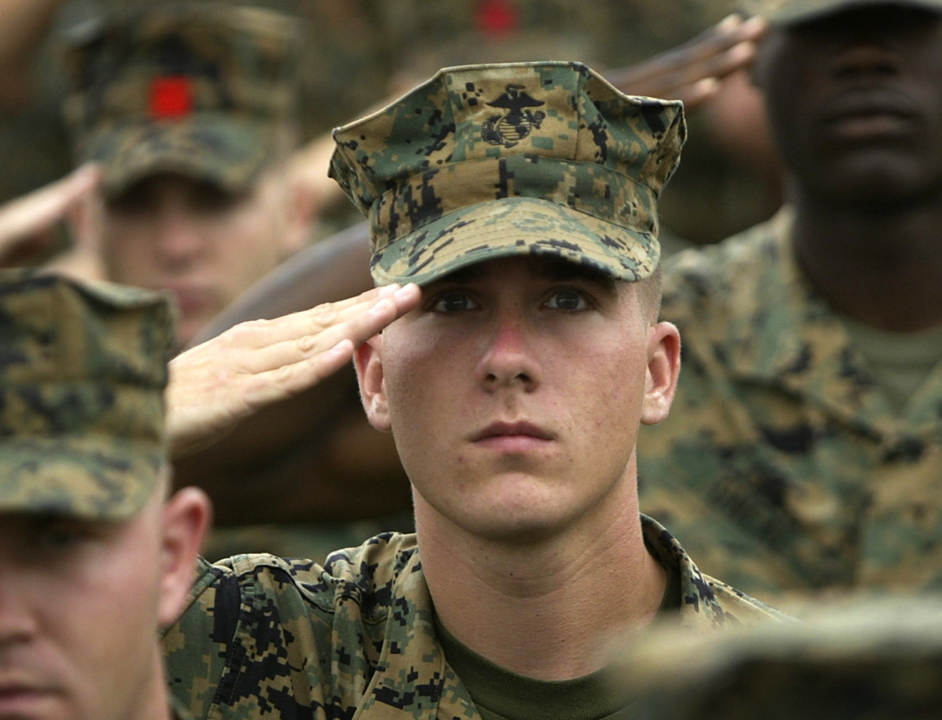 What is the meaning behind the military salute?