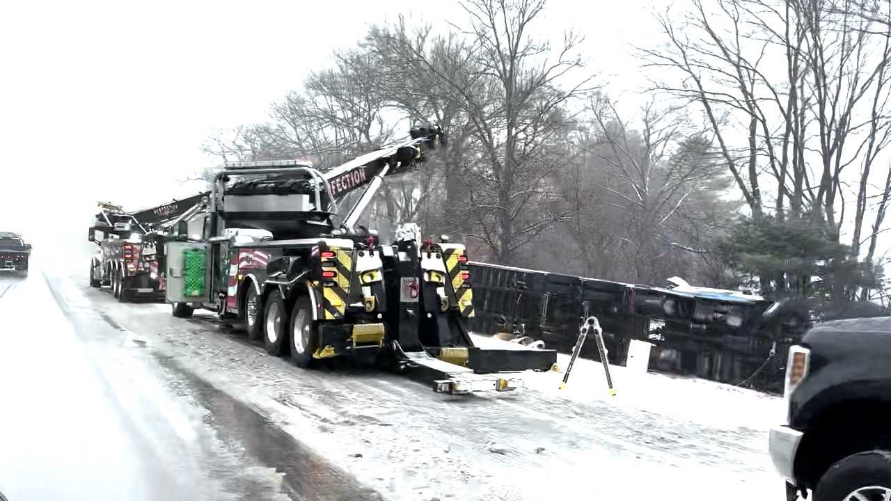 Tractor-trailer overturns along Mass. Pike during winter storm