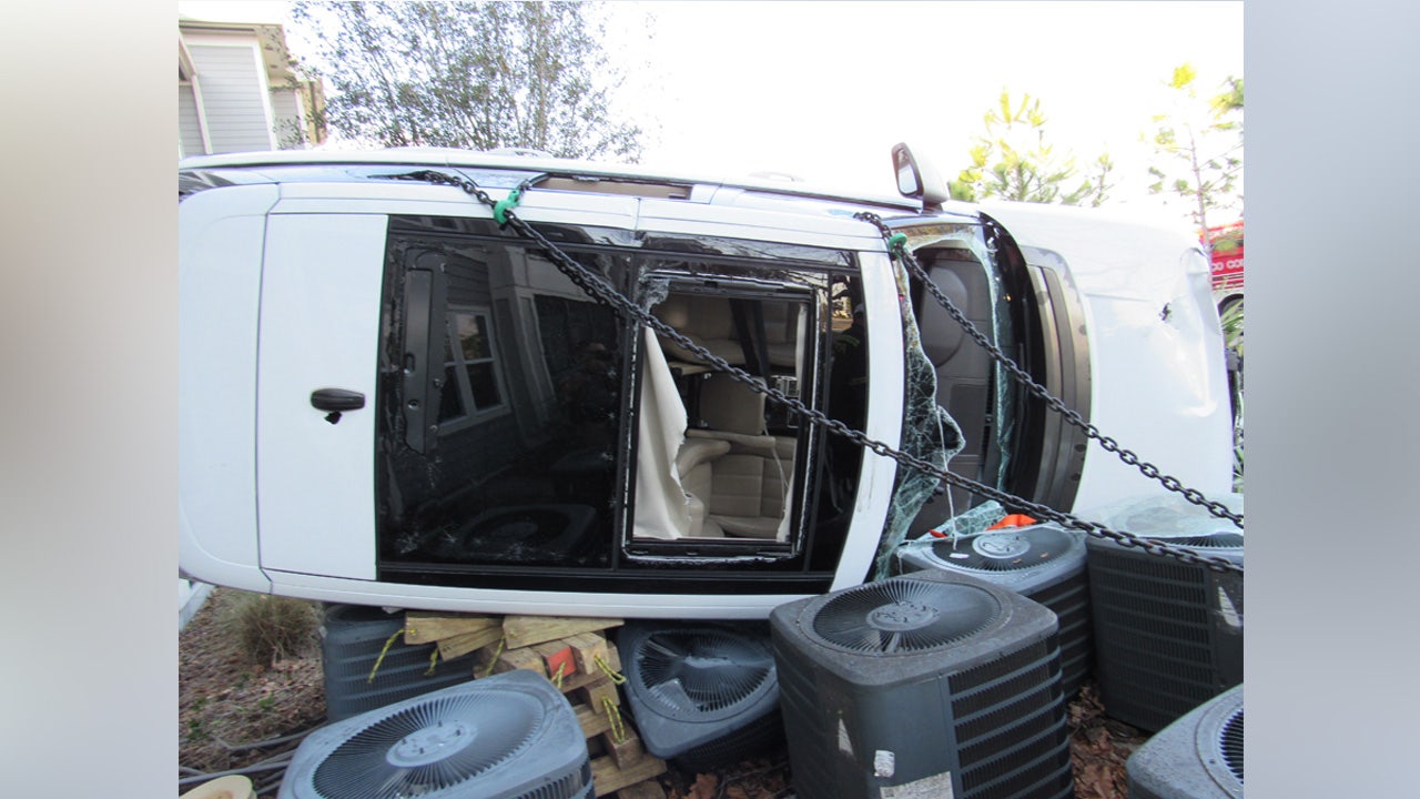 Vehicle overturns, crashes into apartment air conditioning units in ...