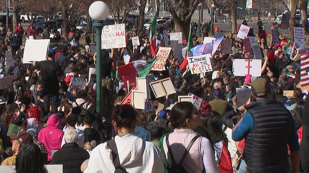 Hundreds of protesters march through downtown Denver