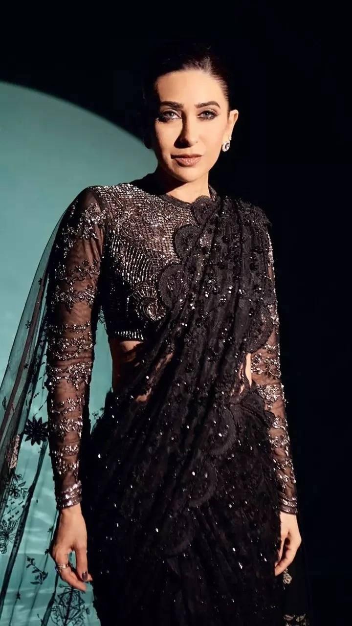 Karisma Kapoor’s black net saree with cape redefines fashion elegance