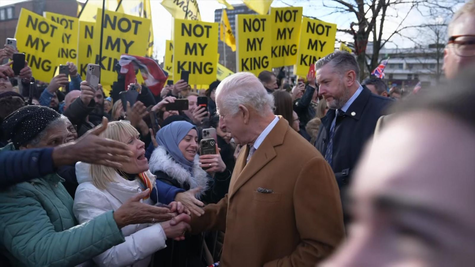 Anti-monarchy protesters shout at The King