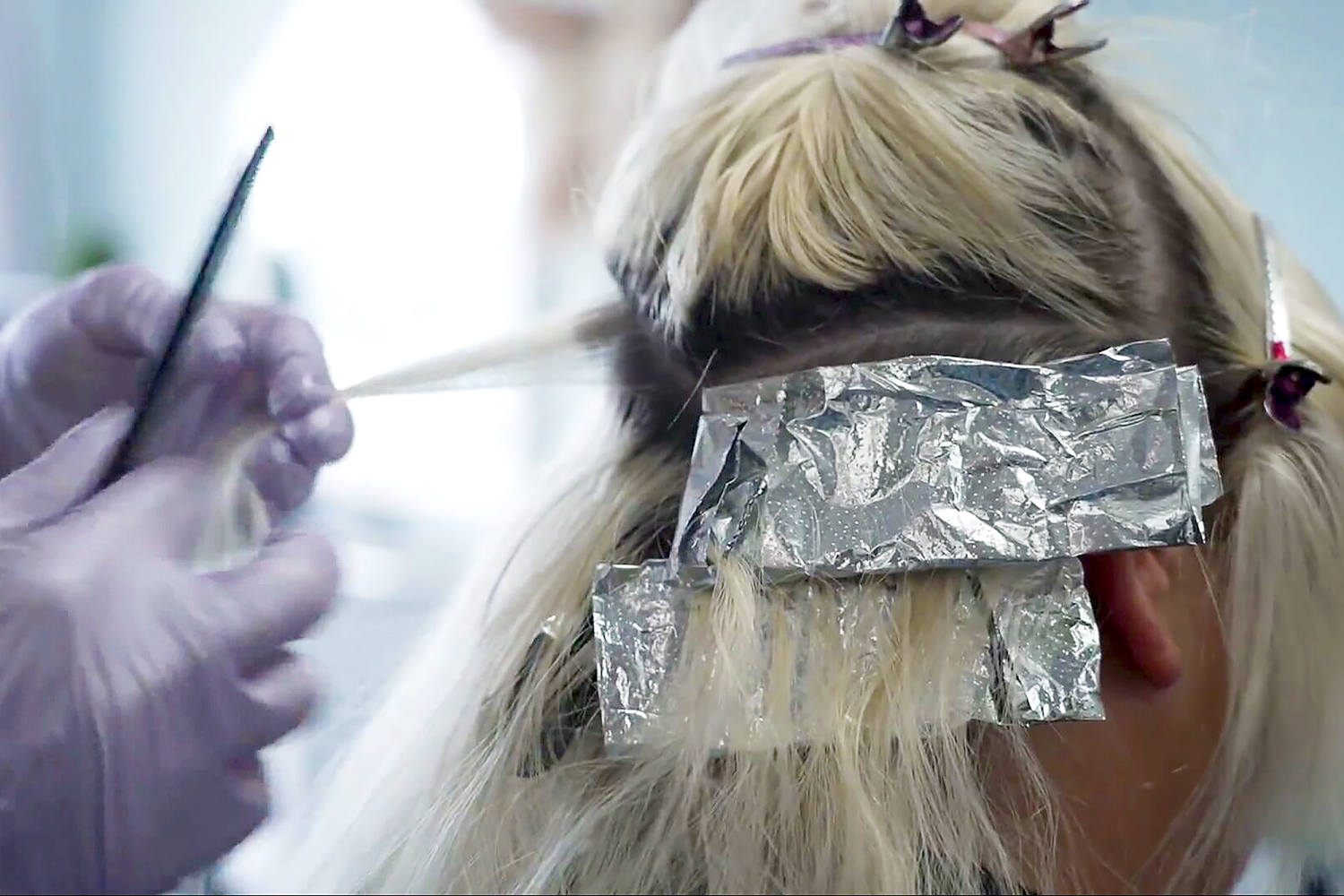 'I'm not normal anymore': Hair stylist sues companies over link between ...