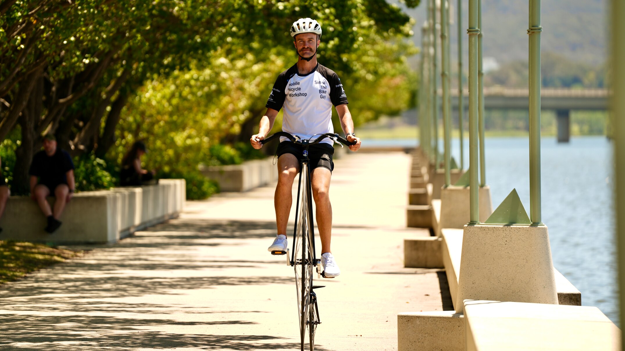 Penny farthing while playing classical guitar helping prepare for ...