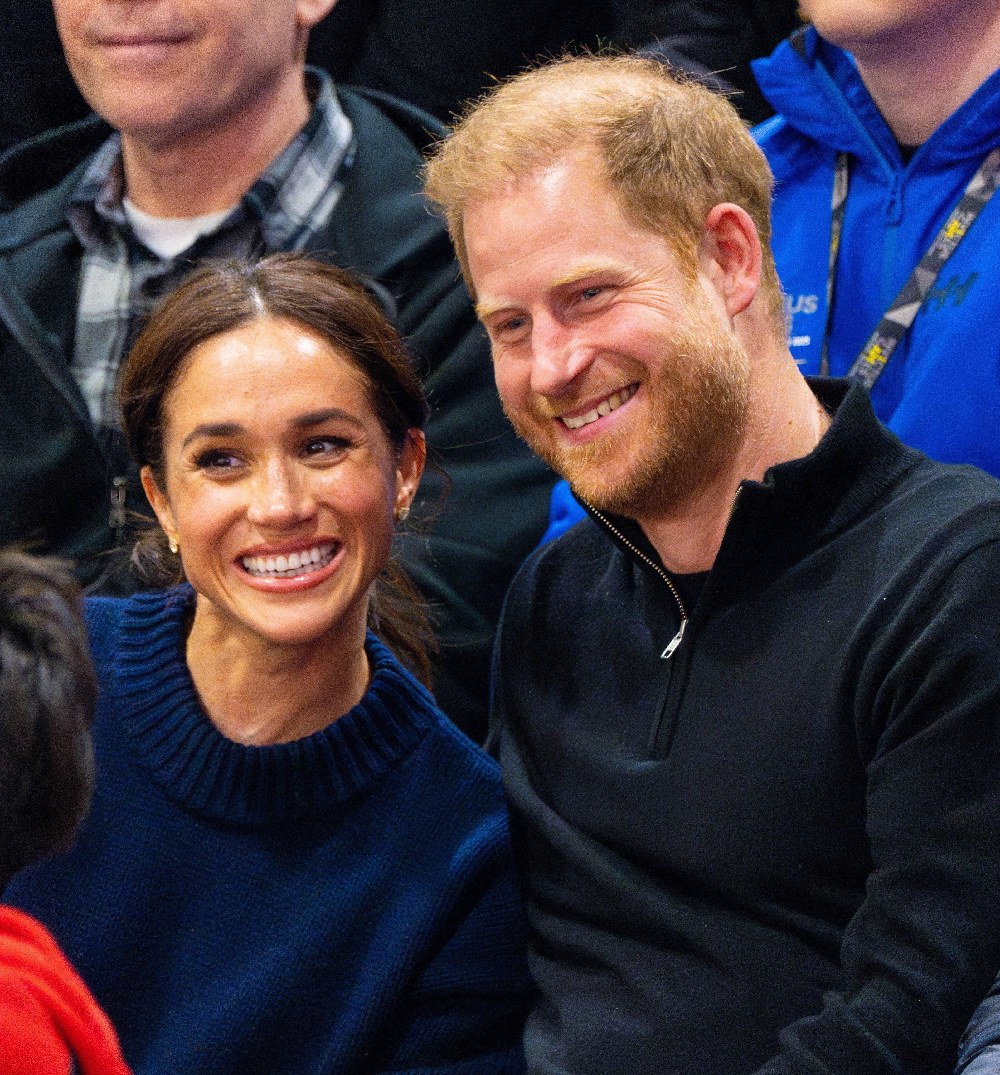 Meghan Markle posts Prince Harry kissing photo as they celebrate ...