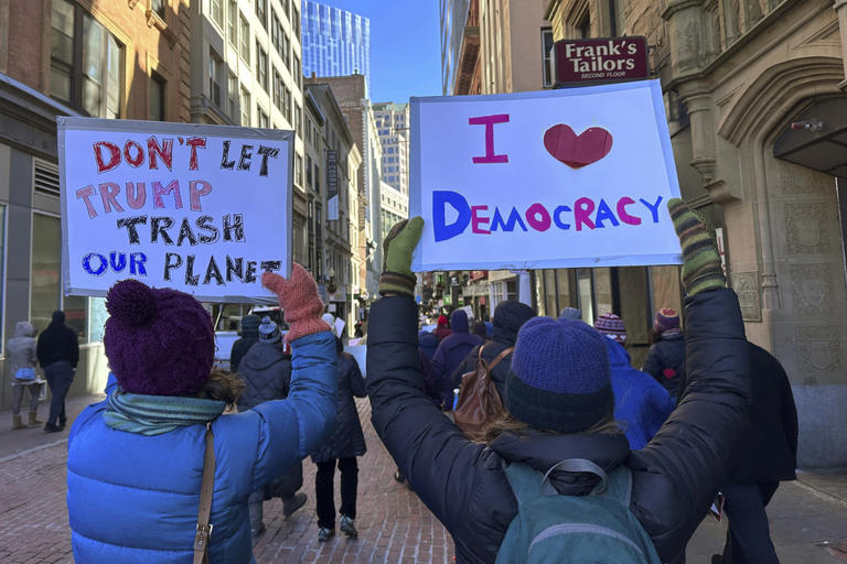 Hundreds march in Boston to support democracy and protest policies of ...