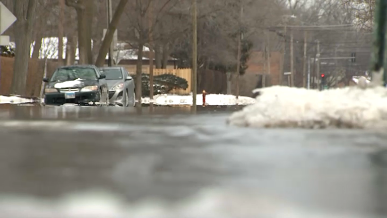 What caused a water main break in Chicago's northern suburbs?