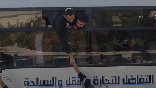 Buses carrying freed Palestinian prisoners welcomed by people in Gaza