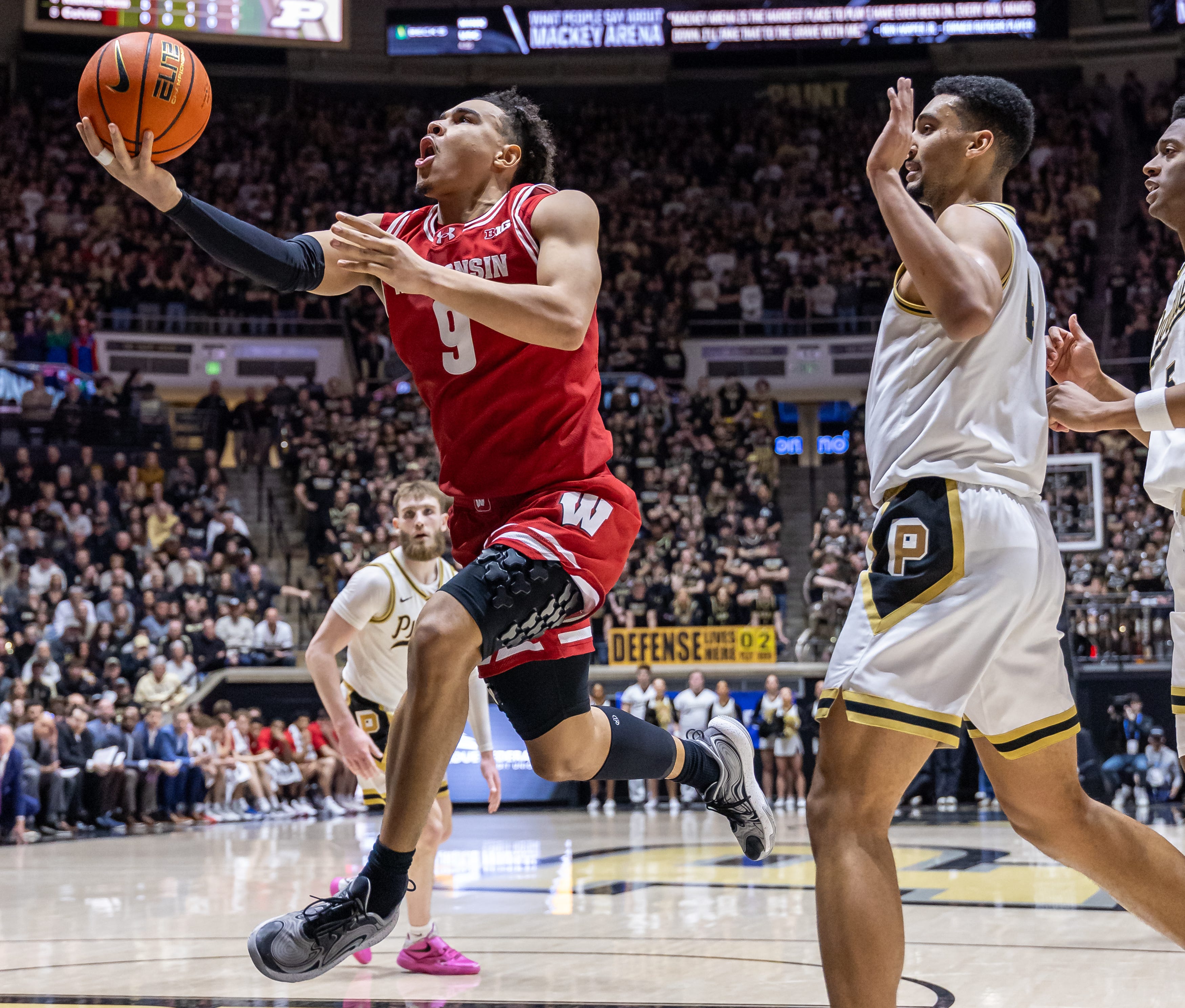 No. 16 Wisconsin overcomes foul trouble, ejection to topple No. 7 ...