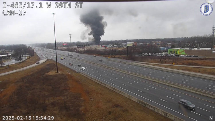 Smoke visible from I-465 after 4 semi cabs catch fire on Indy's west side