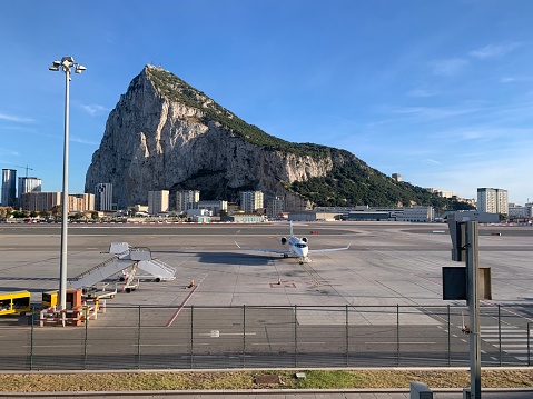 The airport where planes land on a runway crossing a main road