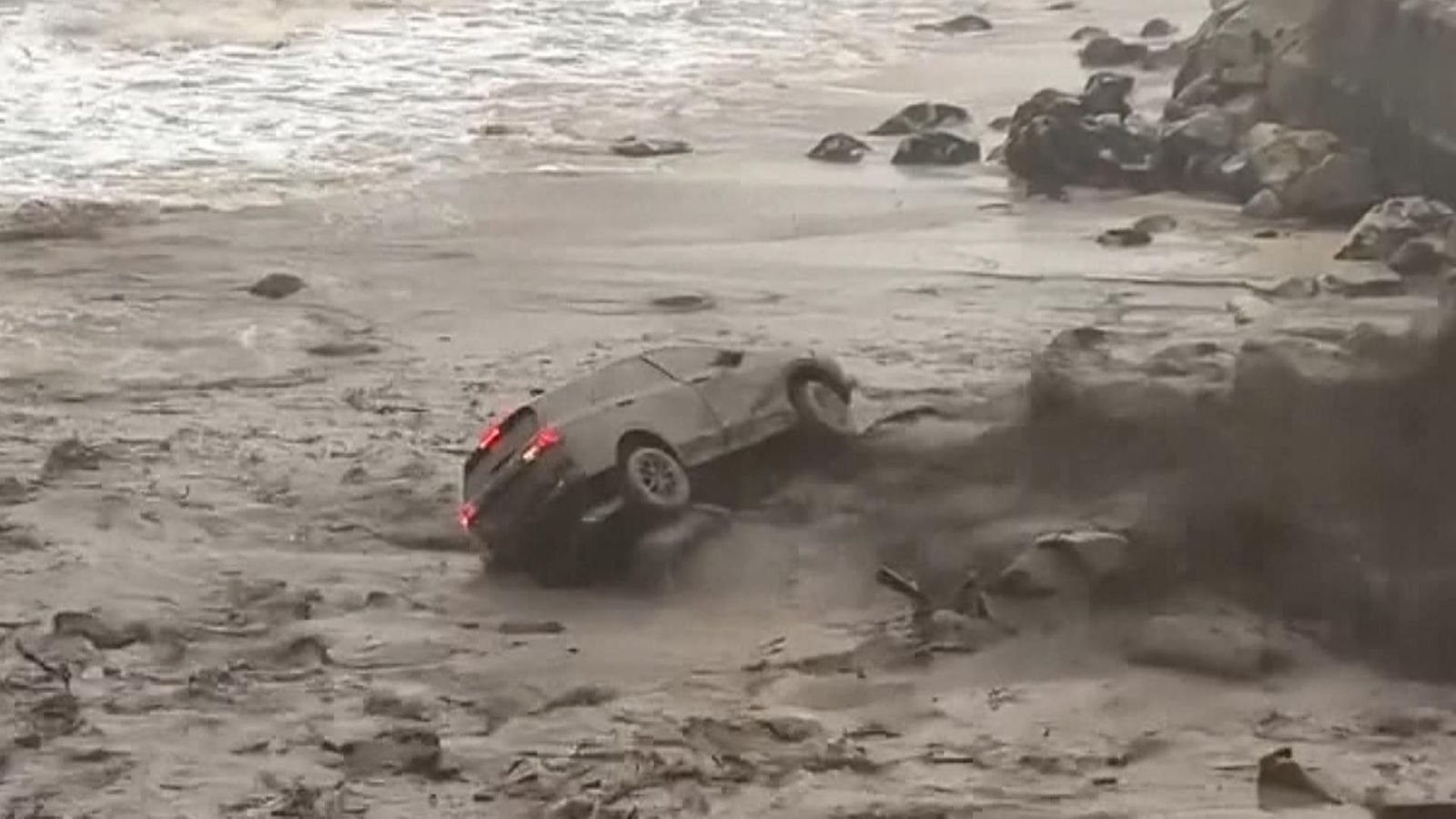SUV swept into ocean by mudslide