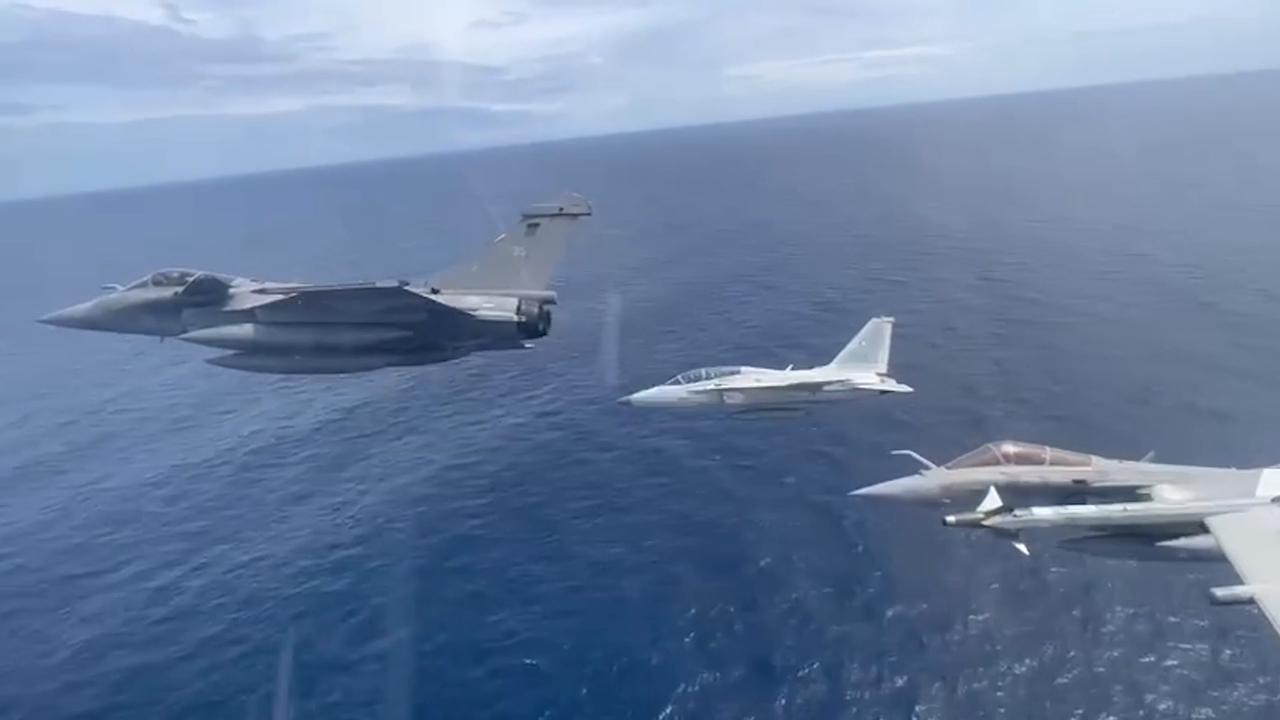 French and Filipino pilots fly alongside each other above Philippine seas