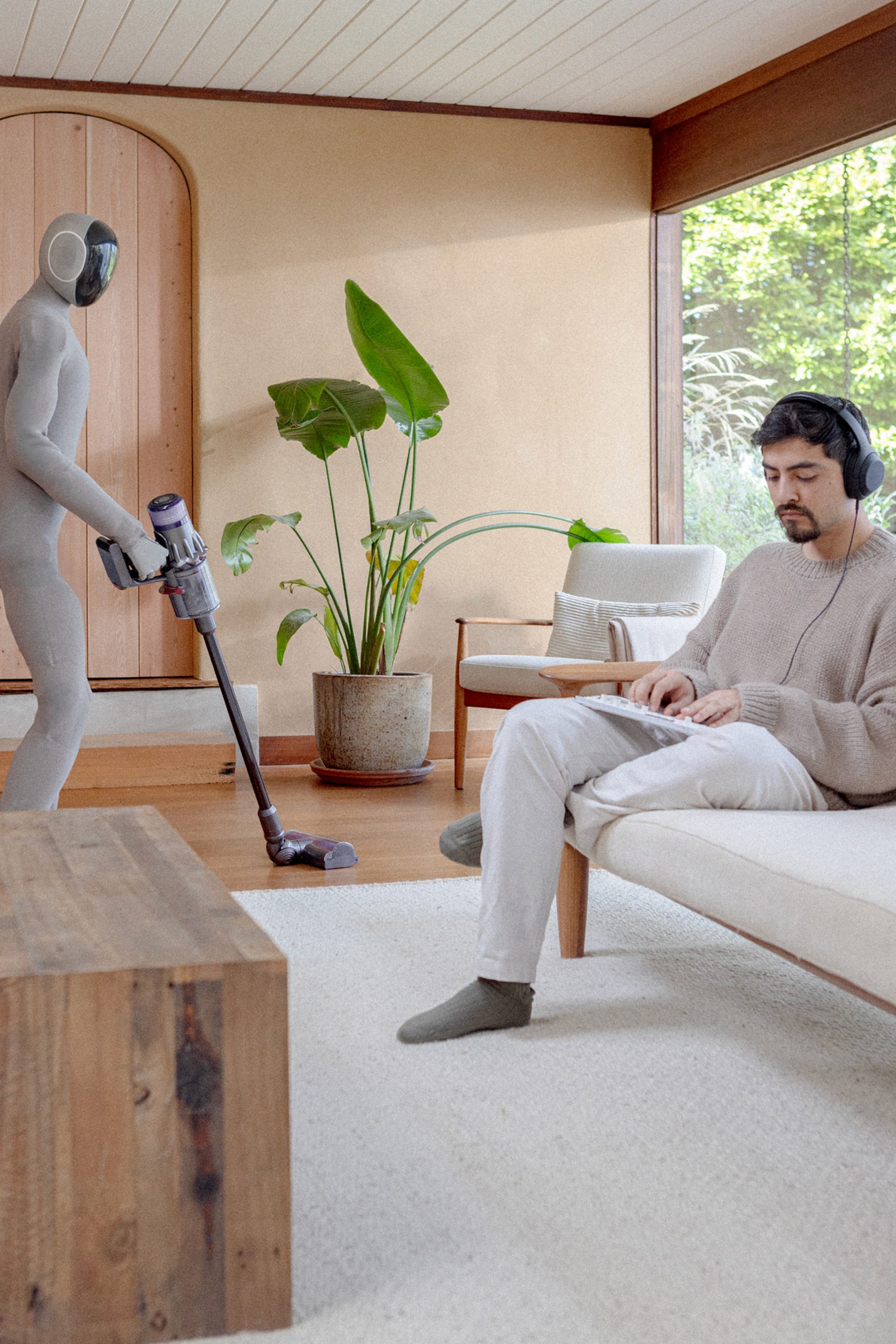 Scandi robot servant Neo Gamma is dressed head-to-toe in beige knitwear