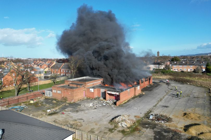 Dramatic footage shows flames and smoke pour from old social club as ...