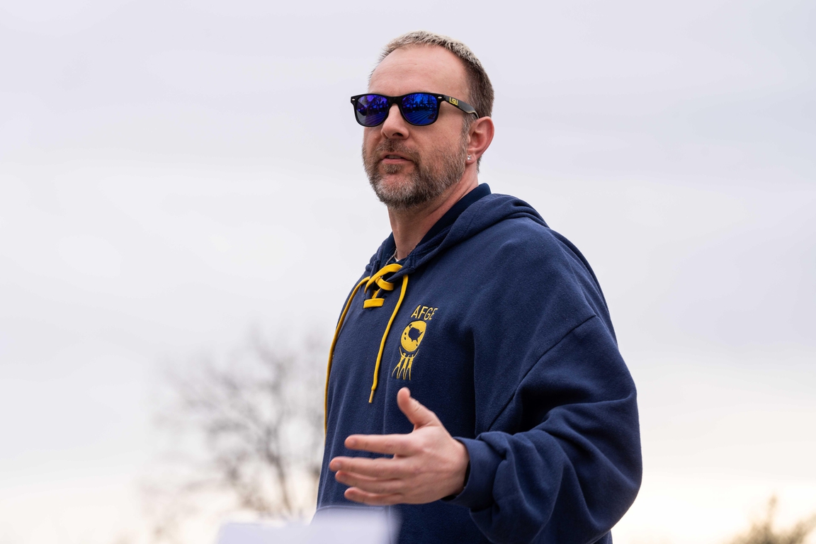 Workers rally outside Iowa Capitol over funding