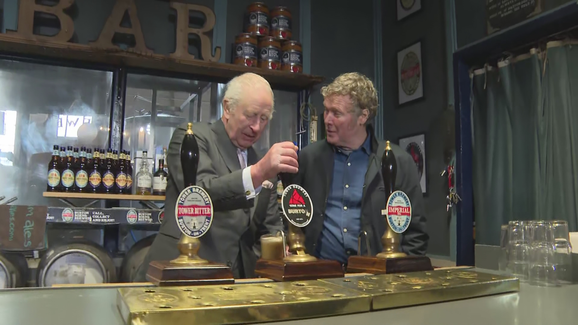 King pours himself a pint on visit to Burton brewery