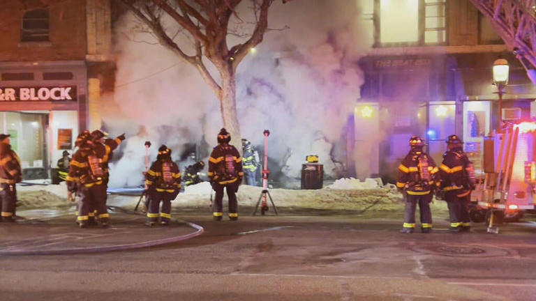 Lowell fire destroys downtown business; firefighters rescue woman with ...