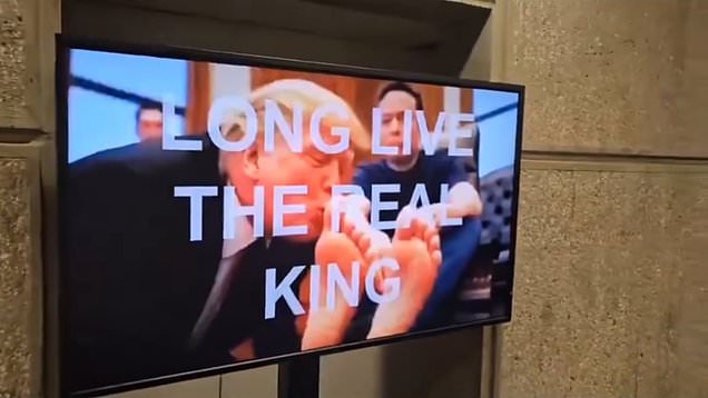 Government TVs hacked to show video of Donald Trump kissing Elon Musk's ...