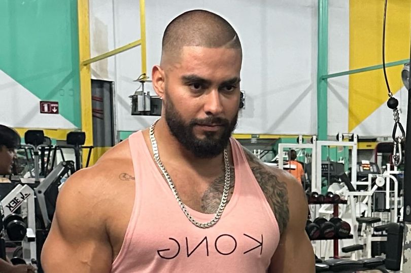 Mystery as bodybuilder found dead after being gunned down in toilet of bar