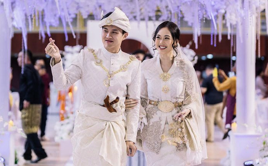 Chinese newlyweds honour unity with traditional Malay wedding look