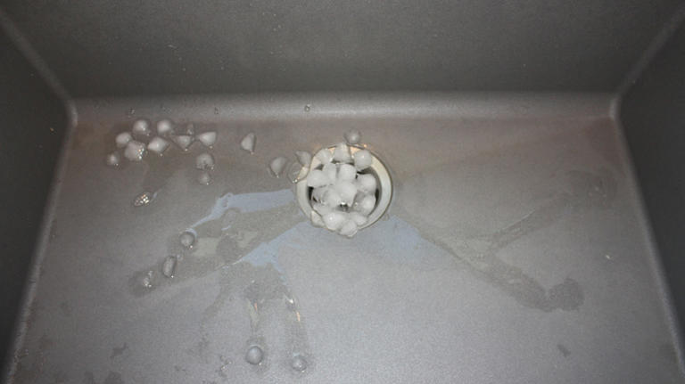 The Cheapest Way To Clean The Garbage Disposal Is In Your Freezer