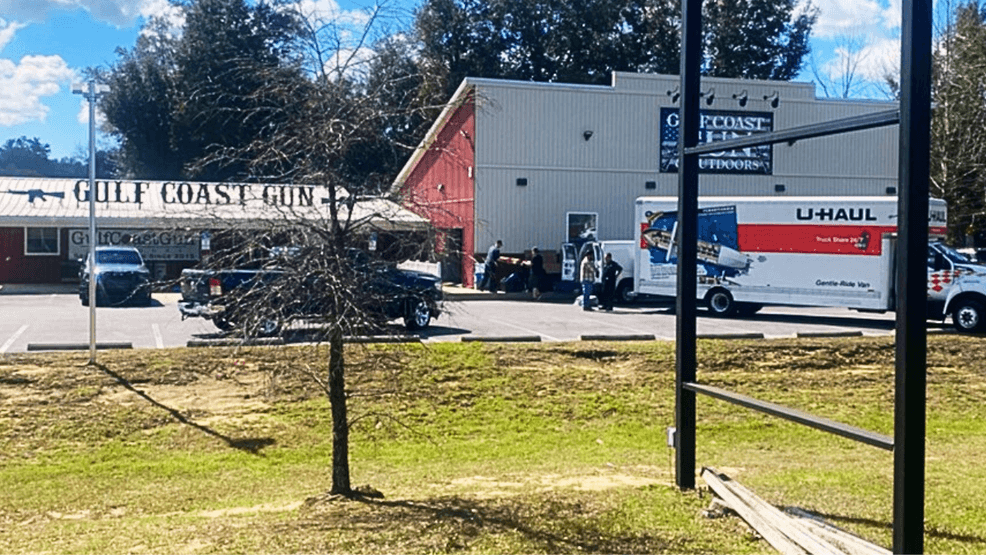 Santa Rosa County deputies executing court order at Gulf Coast Gun in ...