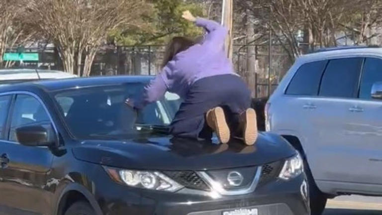 ROAD RAGE VIDEO: Woman jumps on car, cracking windshield; charges filed ...