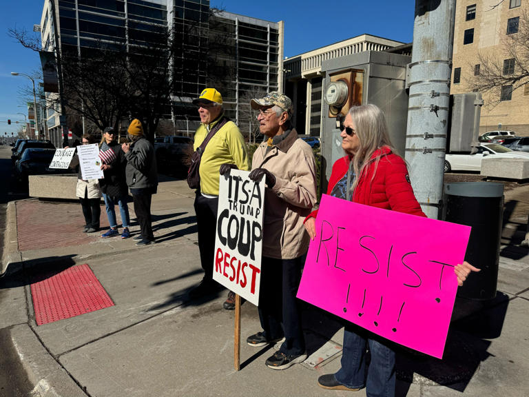 Protestors gather outside Representative Miller-Meeks' office Tuesday ...