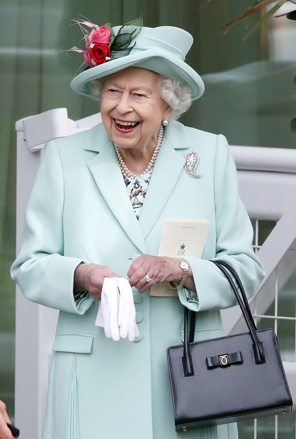 Queen Elizabeth Kept This Genius Item Inside Her Famous Handbags