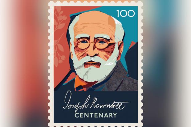 City walls lit in blue and orange to mark Joseph Rowntree's death