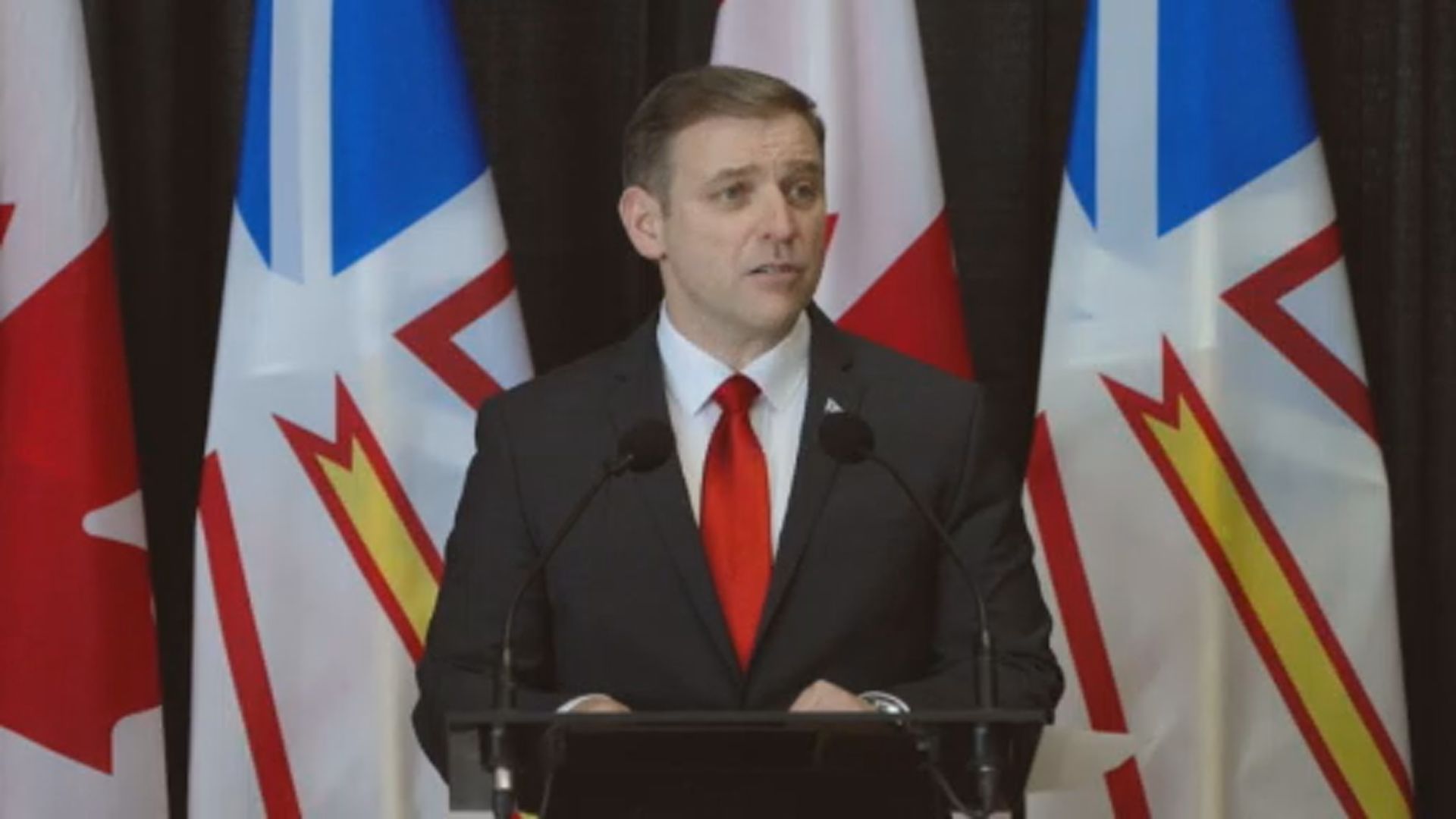 Why is Andrew Furey resigning as premier of N.L.?