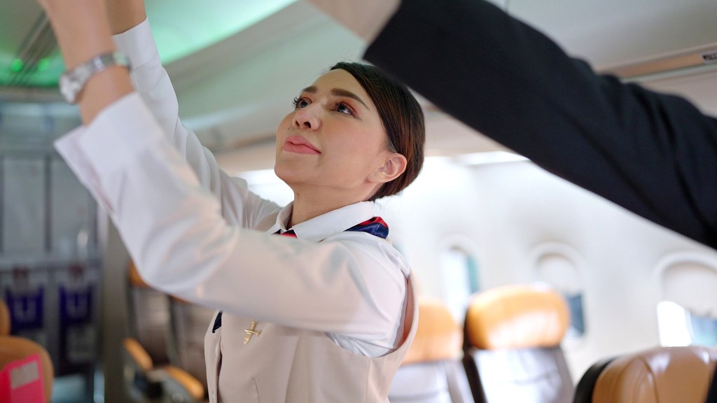 I’m a flight attendant — here’s why you should never grab your bags ...