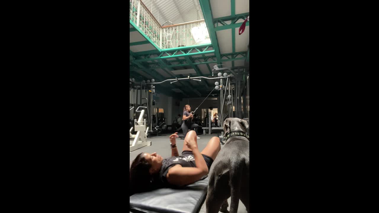 Dog won't leave owner's side during workout in Cuenca, Ecuador