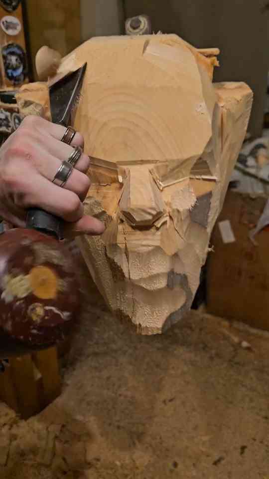 Chainsaw Wood Carving Transforms Block into Detailed Sculpture