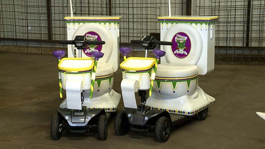 Krewe of Tucks riding on motorized toilets in 2025 parade