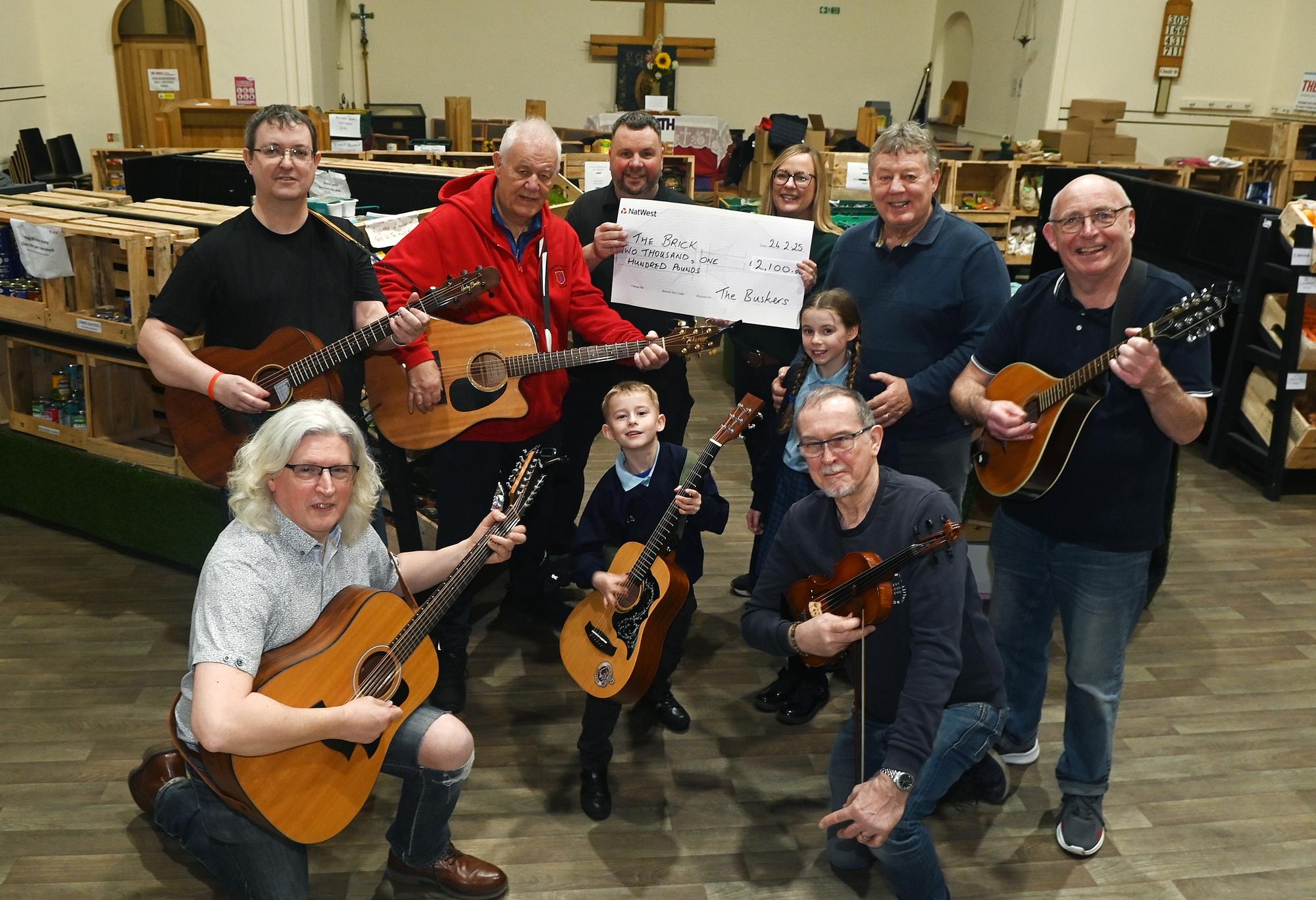 Buskers raises more than £2k for the homeless performing outside Wigan ...